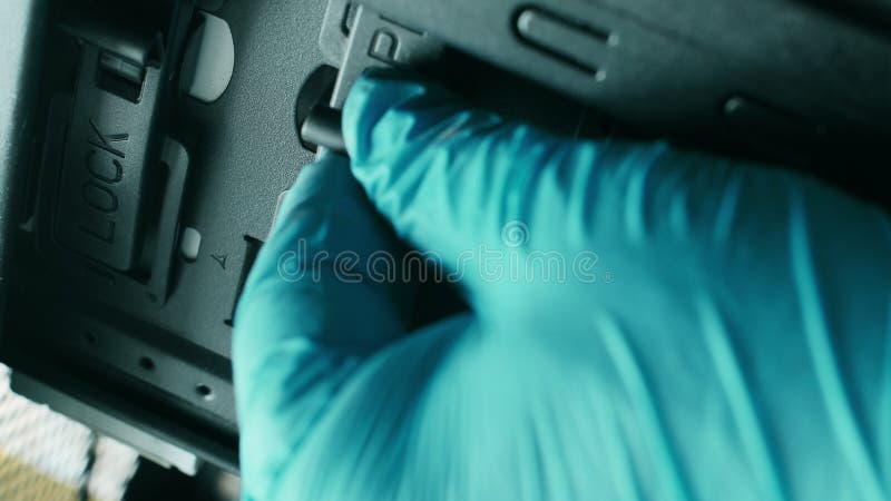 A Blue Gloved Hand Opens the Switches from the Lock To the Open ...