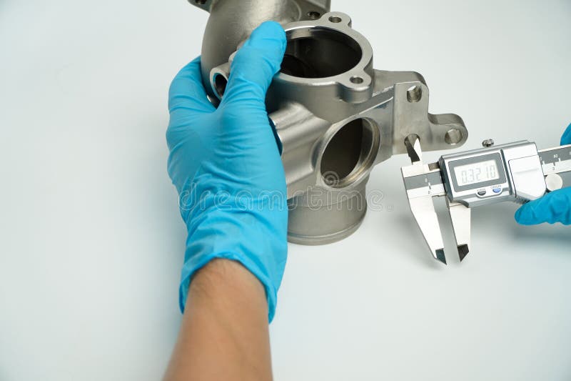 Blue Gloved Hand of Engineer Measuring Metal Parts with Digital Vernier ...