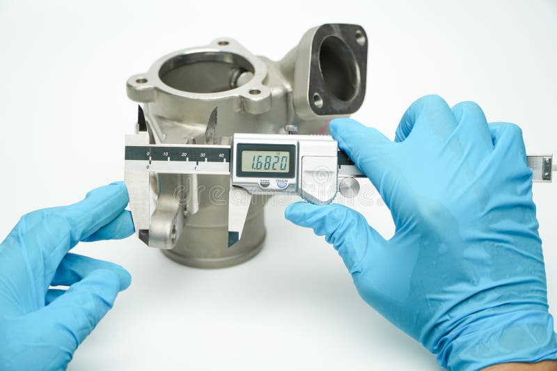 Blue Gloved Hand of Engineer Measuring Metal Parts with Digital Vernier ...