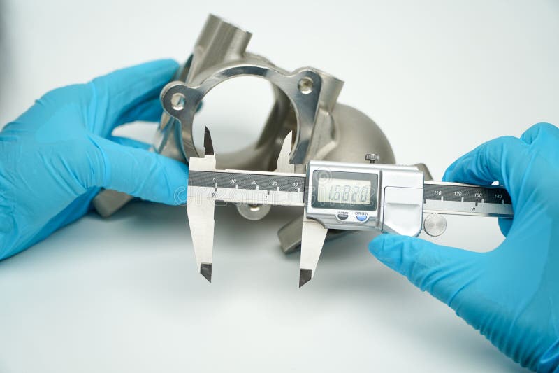 Blue Gloved Hand of Engineer Measuring Metal Parts with Digital Vernier ...