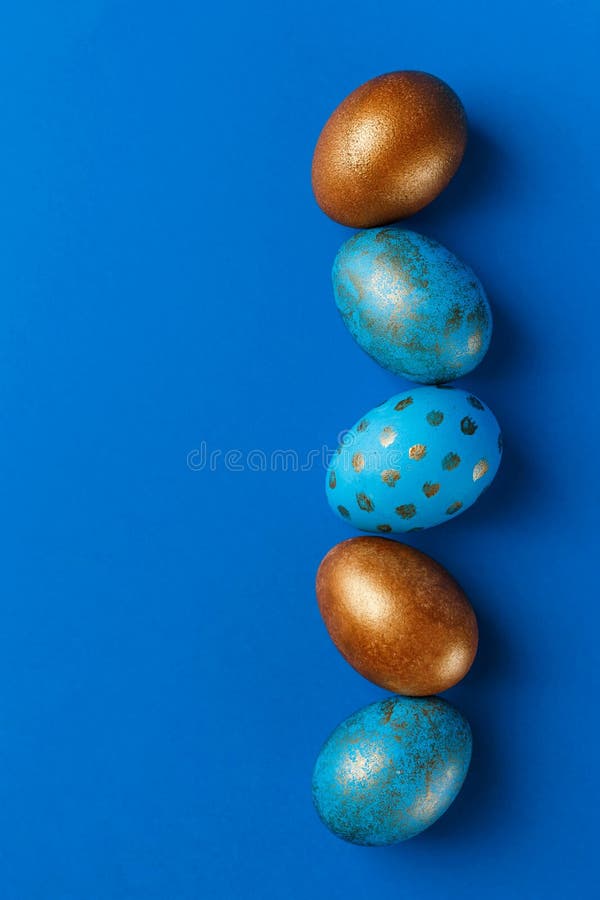 Blue and Golden Modern Easter Eggs in Line on a Blue Background. Easter ...