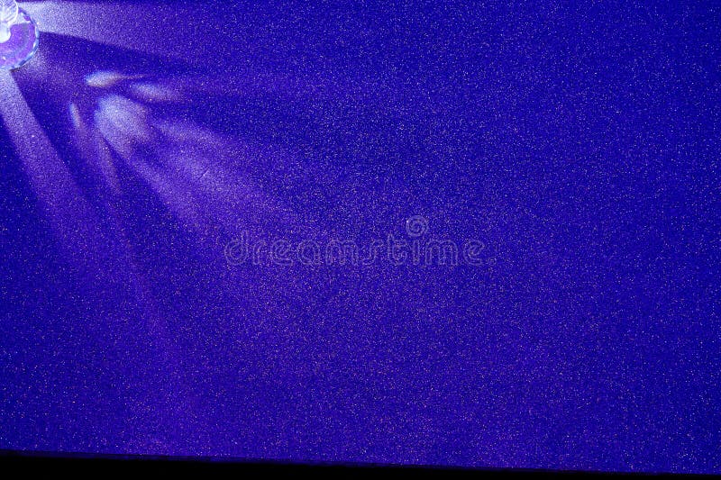 On a Blue Gradient Background, Scattered Light Purple Rays of Light ...