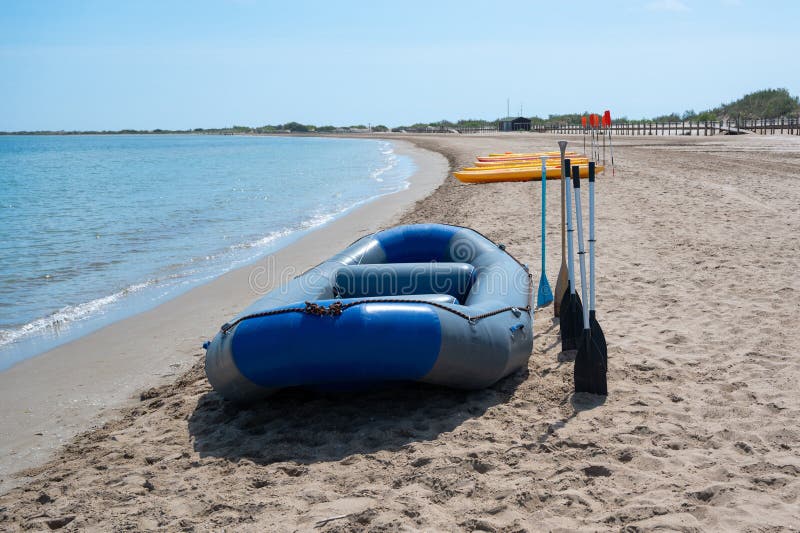 A Blue and Gray Raft is Sitting on the Beach Stock Image - Image of ...