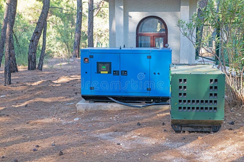 Blue and Green Coloured Generators Installed in a Plant. Alternative ...
