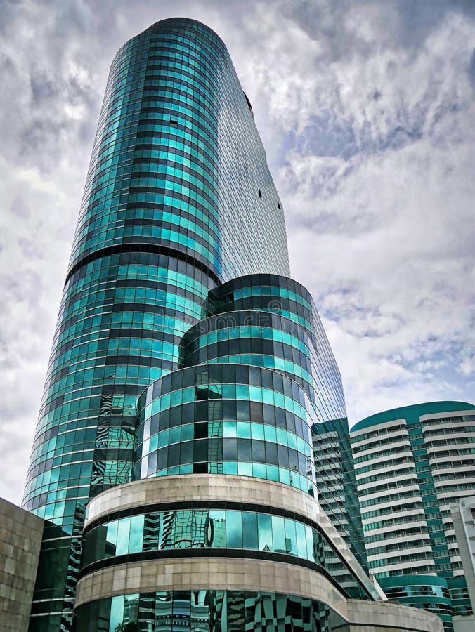 Blue Green Modern Building Against Blue Cloudy Sky Stock Photo - Image ...