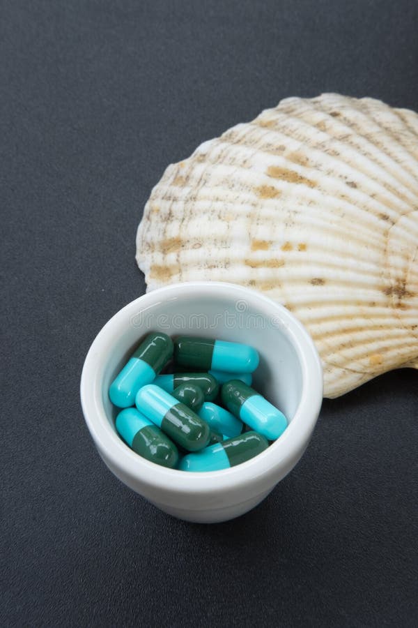 Heap of Blue Green Round Capsule Pills with Medicine Antibiotic Stock ...