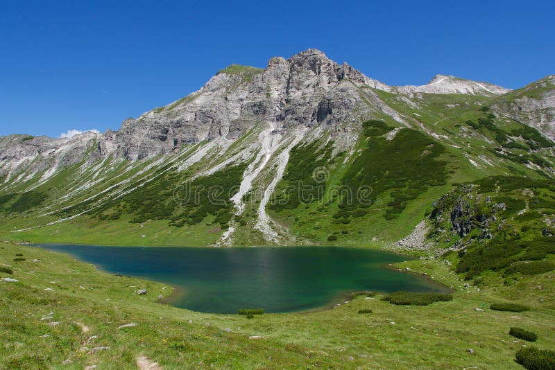 Emerald Alpine Lake with Mountains Stock Photo - Image of austria ...