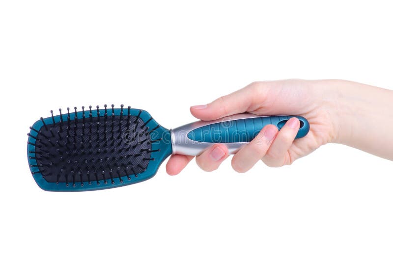 Blue hair brush in hand stock photo. Image of bristles - 180152544