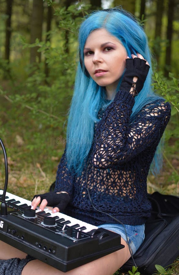 Blue-haired musician girl stock photo. Image of keys - 65348682