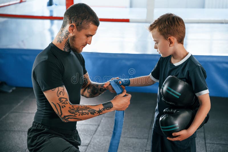 Blue Hand Wraps. Coach is Teaching the Boy Box Techniques Indoors Stock ...