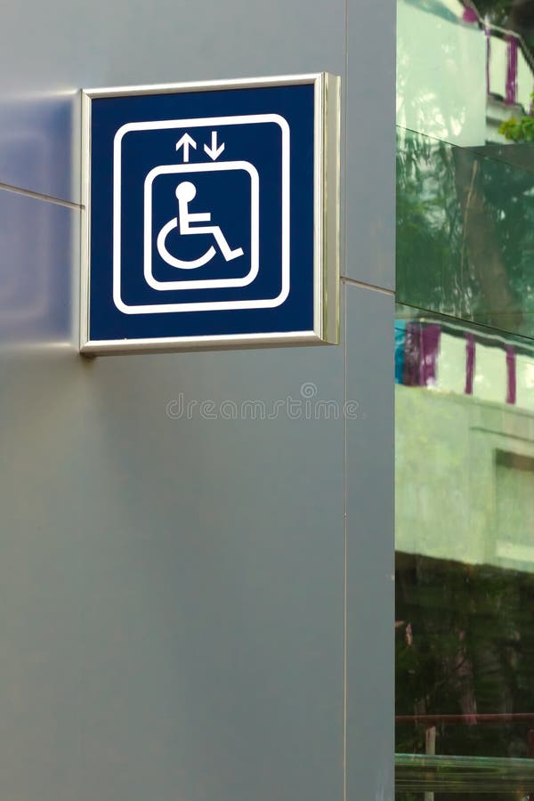 Blue Handicap Sign on the Street - a Symbol for Mobility Aid for People ...