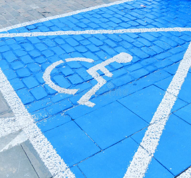 Blue Handicap Parking Sign on Asphalt for Persons with Disability Stock ...