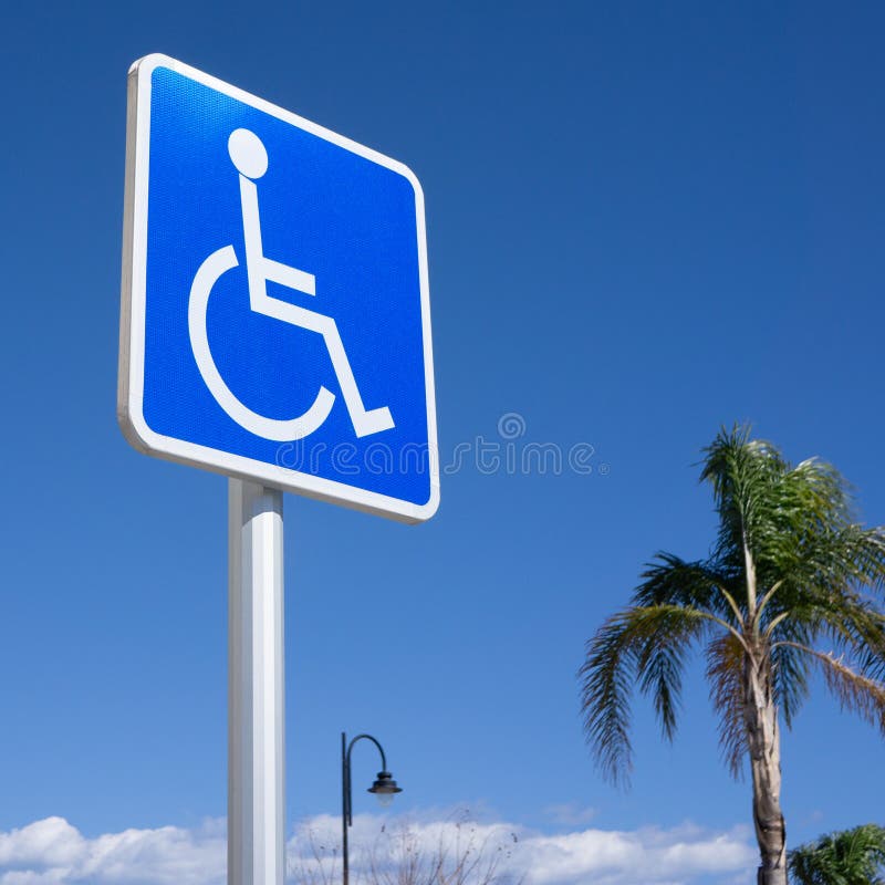 Blue Handicapped Parking Sign with Blue Sky Background Stock Photo ...