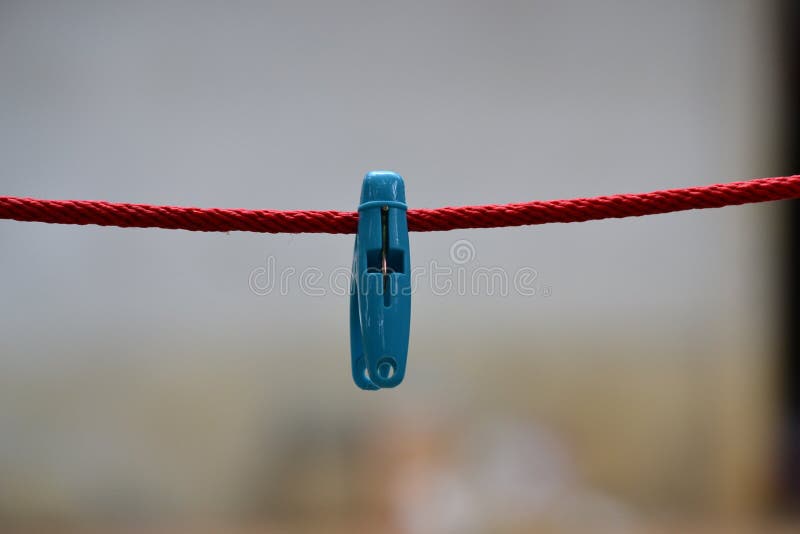 Blue Hanger on the Red Rope Stock Photo - Image of alone, rope: 66124998