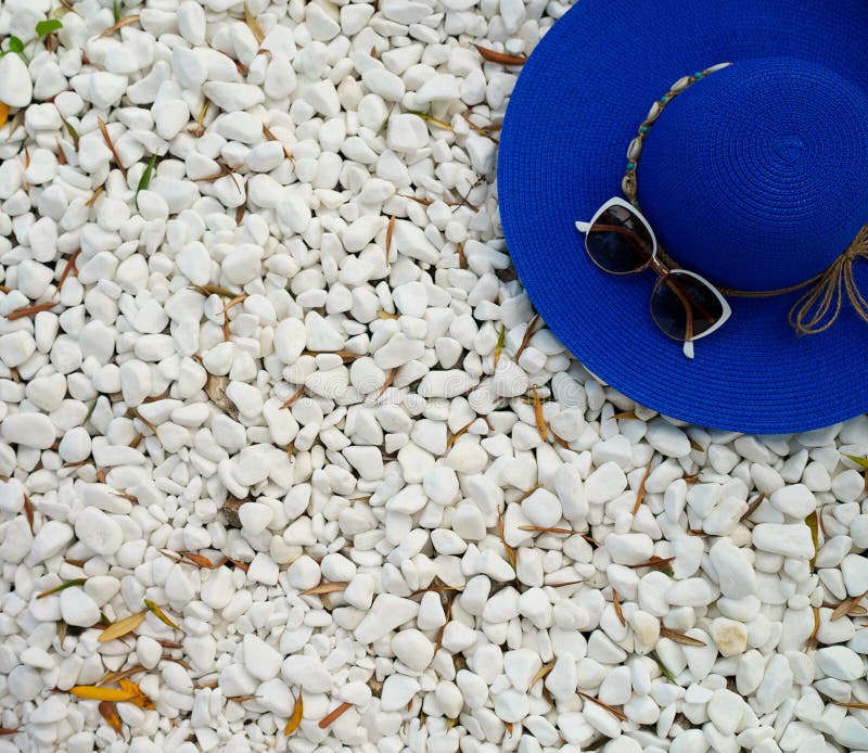 Blue Hat with Sunglasses Lies on the Rocks Stock Photo - Image of rock ...