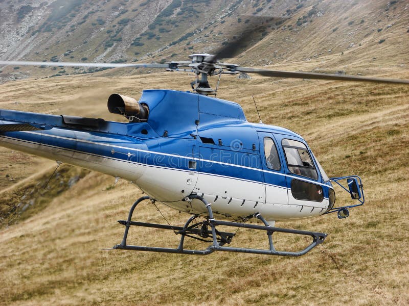 Blue helicopter flying stock image. Image of aerial - 111992301