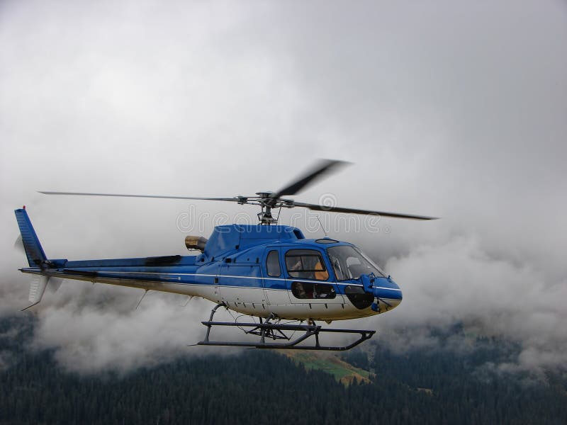 Blue helicopter flying stock image. Image of outdoor - 111992305
