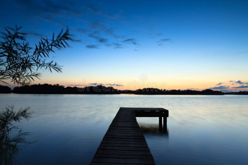 Blue hour at a lake stock photo. Image of movement, horizon - 36780550