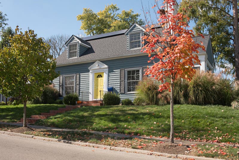 Cape Cod House with Three Dormers & Red Door Stock Photo - Image of ...