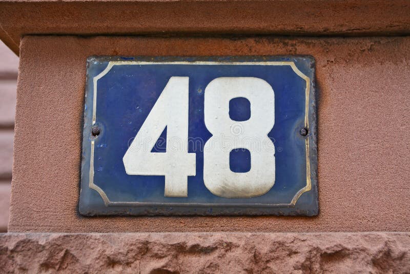 A Blue House Number Plaque, Showing the Number Forty Eight Stock Photo ...