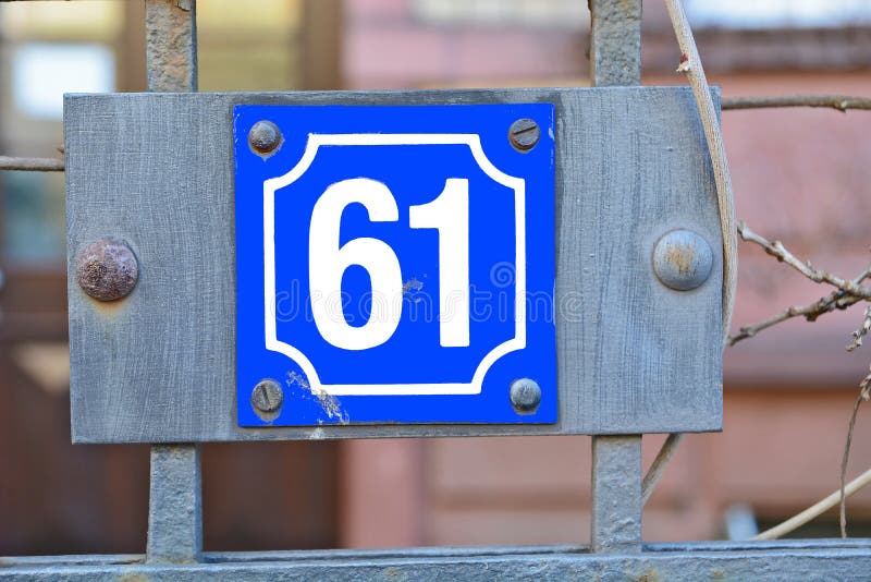 A Blue House Number Plaque, Showing a Framed Number Sixty One Stock ...