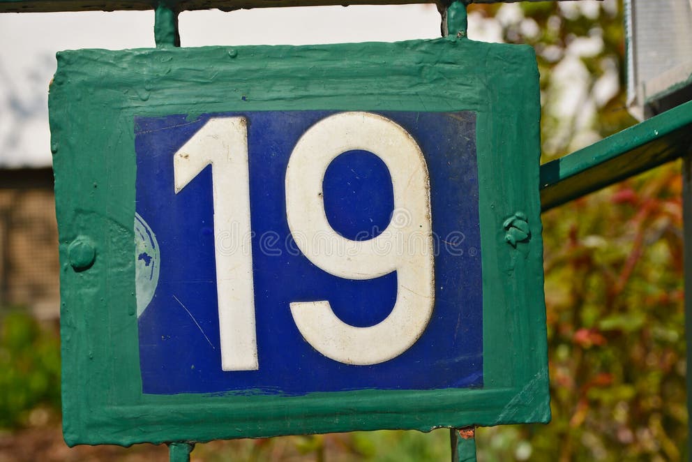 A Blue House Number Plaque, Showing the Number Nineteen Stock Image ...