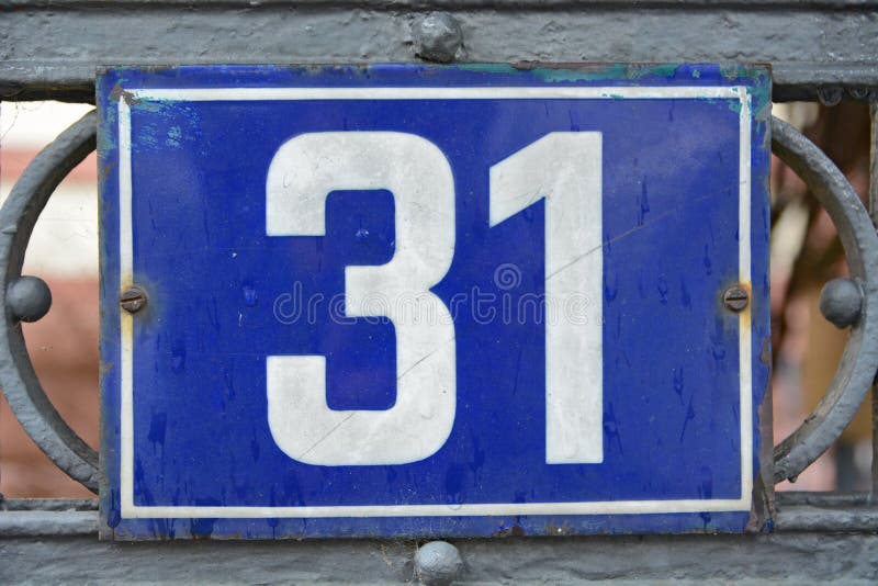A Blue House Number Plaque, Showing the Number Thirty One Stock Photo ...