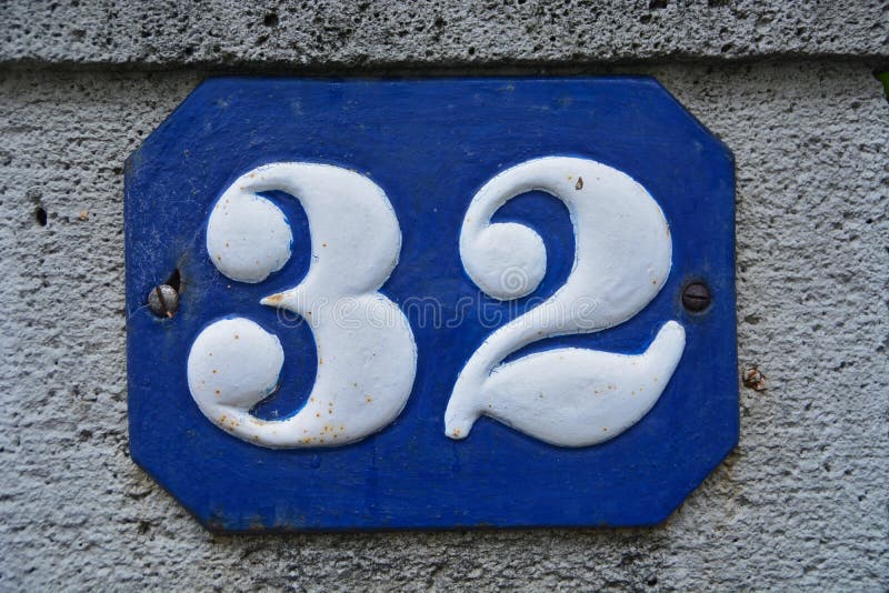 A Blue House Number Plaque, Showing the Number Thirty Two Stock Image ...