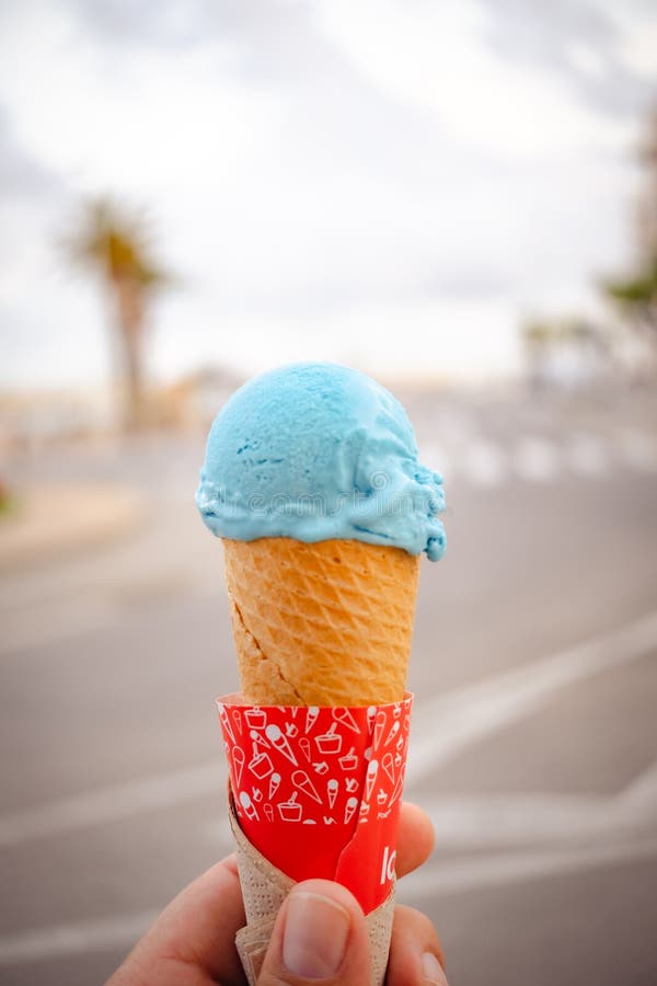 Blue Ice Cream Cone with Blurred Background Stock Image - Image of ...