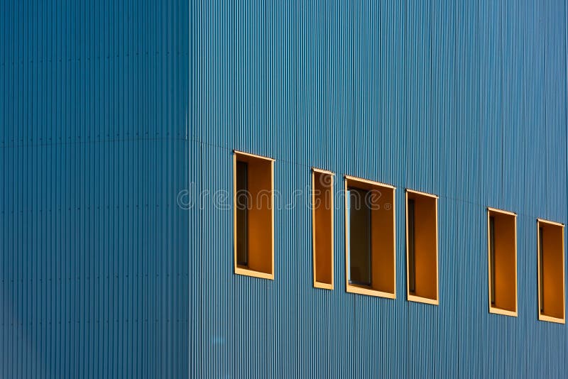 Blue Industrial Warehouse with Yellow Window Frames.. Stock Image ...
