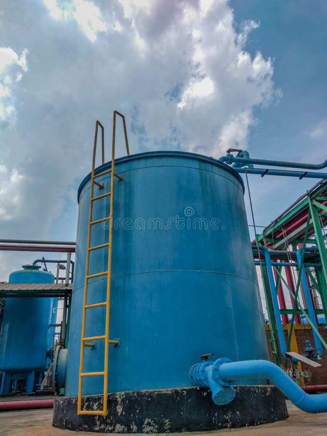 Blue Industrial Water Tank with Yellow Ladder Stock Image - Image of ...
