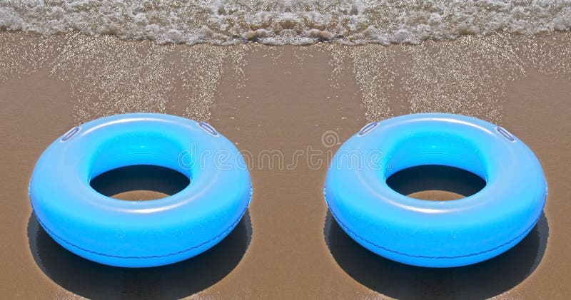 A Blue Inflatable Donut on the Seashore Stock Image - Image of ring ...