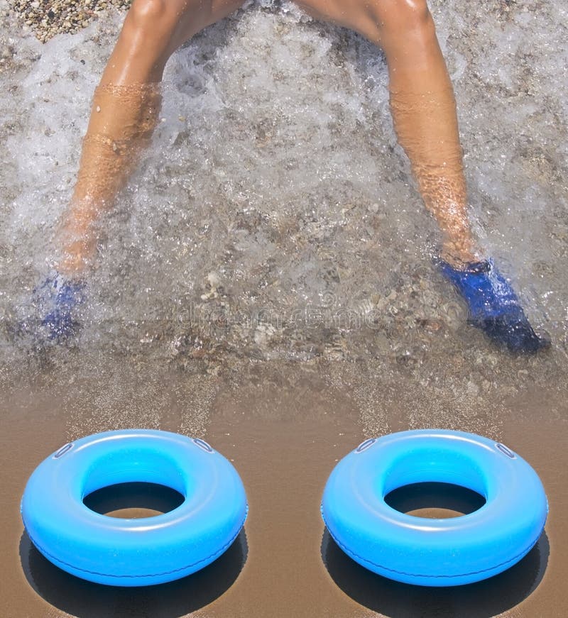 A Blue Inflatable Donut on the Seashore Stock Photo - Image of outdoors ...