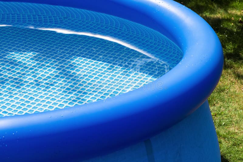 Blue inflatable pool stock image. Image of activity - 197945107