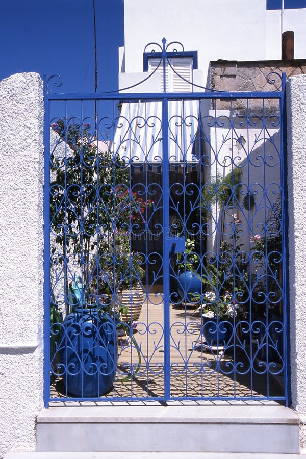 Blue Iron Fence in Greece stock photo. Image of gated - 12045310