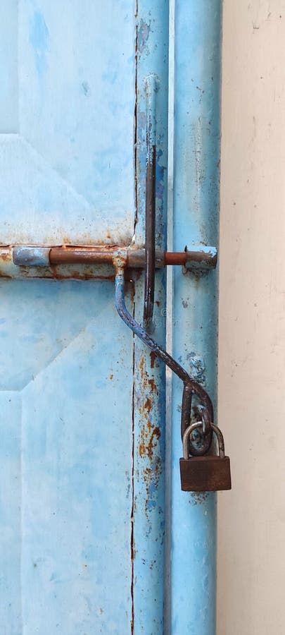 Blue Iron Gate with a Deadbolt and Padlock Stock Photo - Image of aged ...