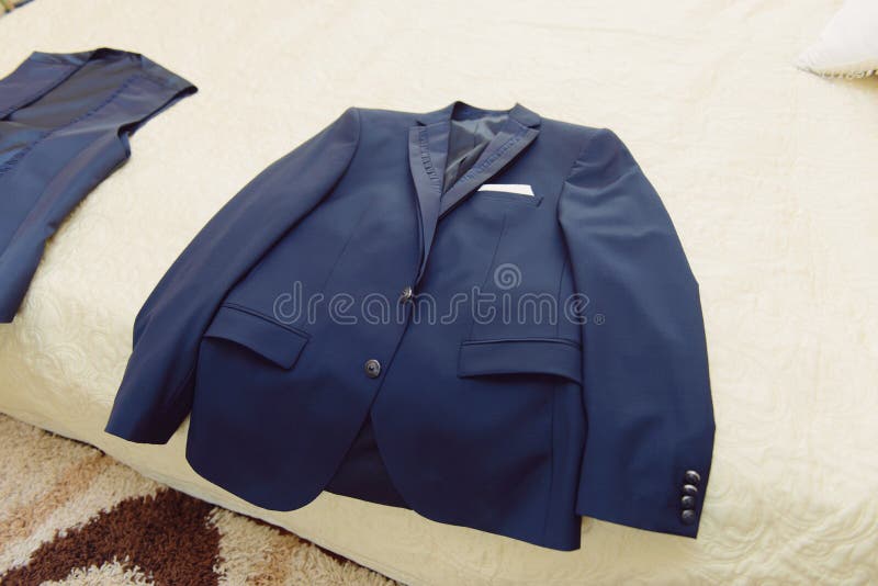 Blue Jacket on Bed stock photo. Image of people, husband - 47854726