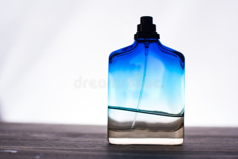 Blue Jar of Perfume in Hand Stock Photo - Image of glamour, background ...