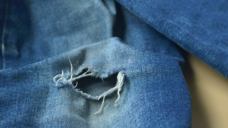 Blue Jean Texture with a Hole and Ripped Threads Showing Stock Video ...