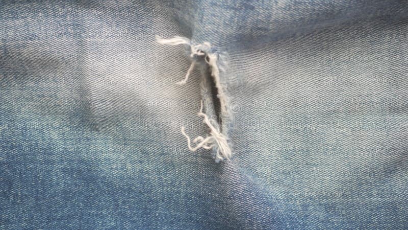 Blue Jean Texture with a Hole and Ripped Threads Showing Stock Video ...