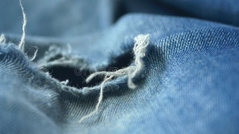 Blue Jean Texture with a Hole and Ripped Threads Showing Stock Video ...