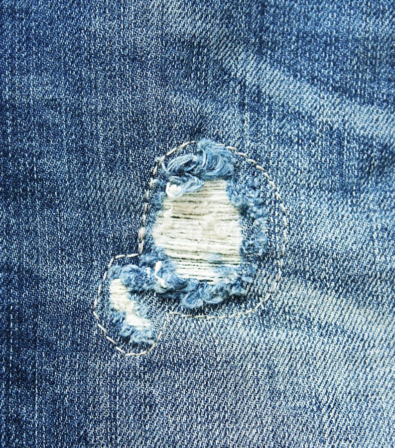Blue Jean Texture with a Hole and Threads Showing Stock Image - Image ...