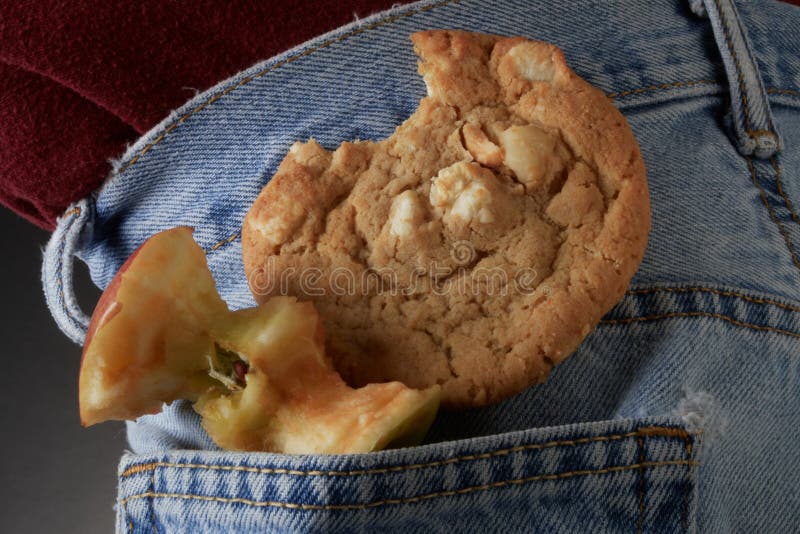 Apple Core and Cookie Stuffed into Pants Pocket Stock Photo - Image of ...