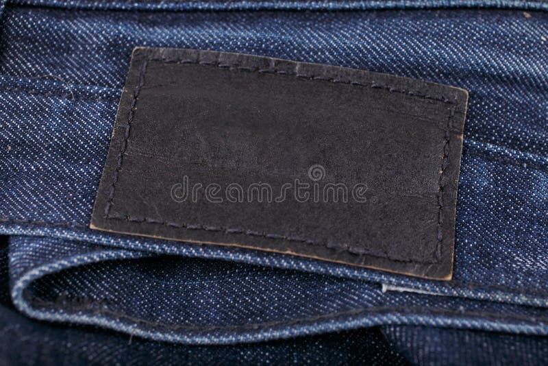 Blue Jeans with Black Leather Tag Stock Image - Image of pocket, canvas ...