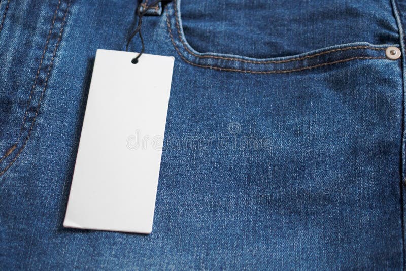 Blue Jeans with White Price Label Tag Stock Photo - Image of casual ...