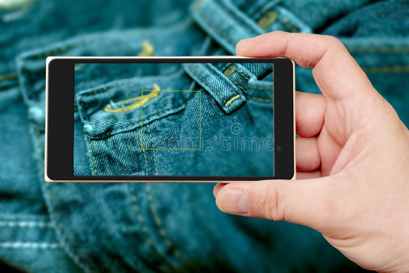 Blue Jeans on Smartphone Screen. Stock Photo - Image of material, fiber ...