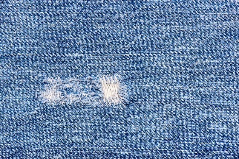 Blue jeans torn fabric stock photo. Image of jeans, denim - 33160938