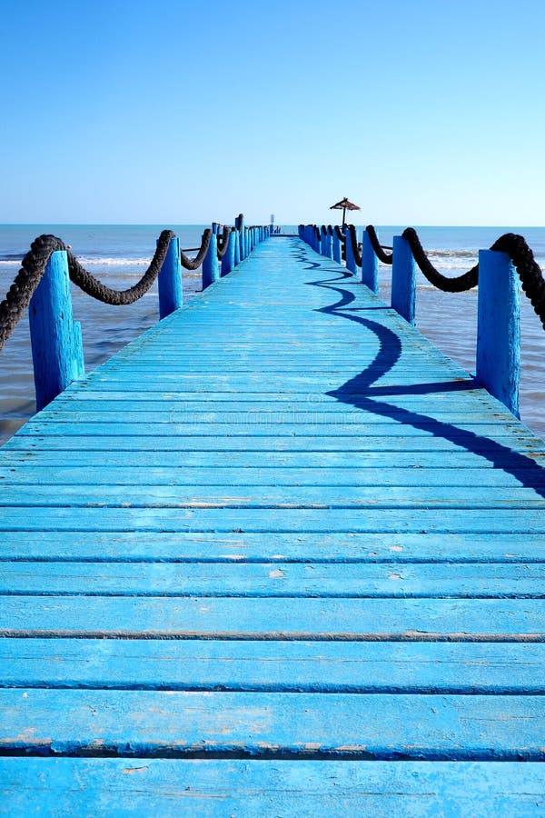 Long Blue Pier into the Ocean Stock Image - Image of distance, ocean ...