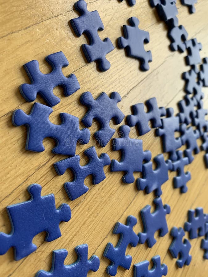 Blue jigsaw puzzle pieces stock image. Image of puzzle - 180912873