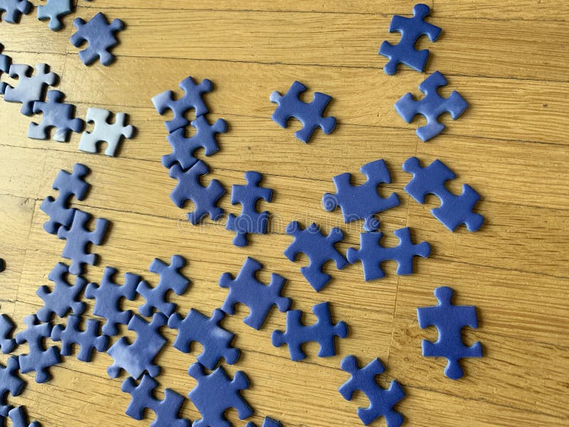 Blue jigsaw puzzle pieces stock photo. Image of solved - 180912878